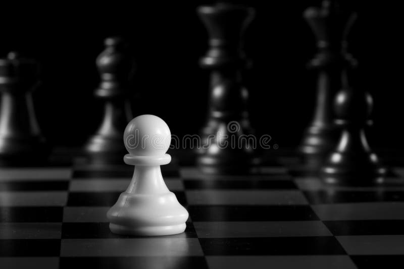 One Against All - a Black Pawn with White Chess Pieces Stock Photo ...
