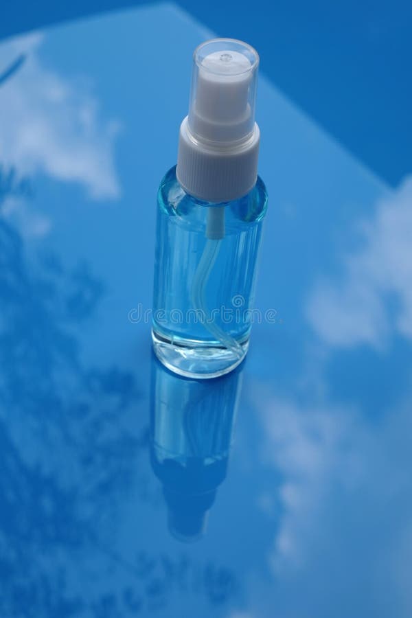 One Alcohol Bottle with a Blue Liquid in the Background is the Same ...