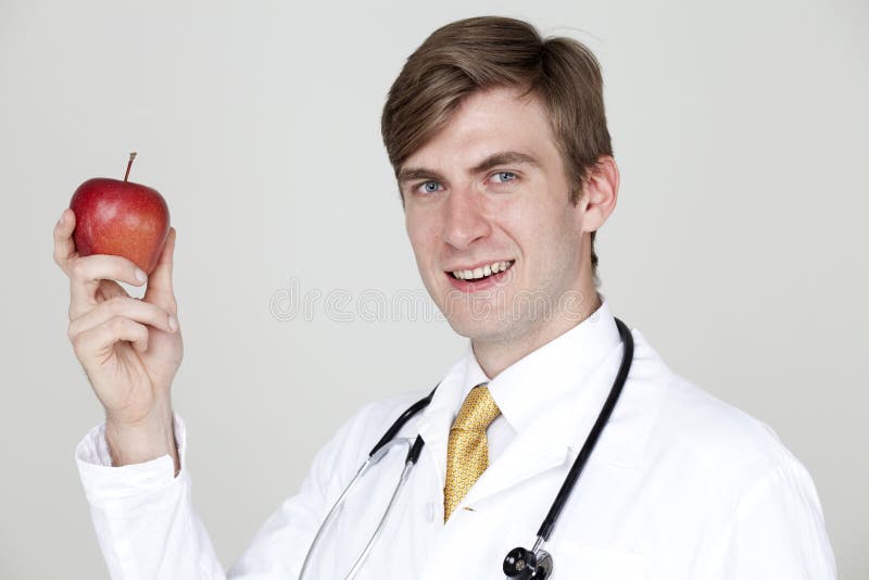 Smiling Doctor Keeping an Apple in Hand Stock Image - Image of ...
