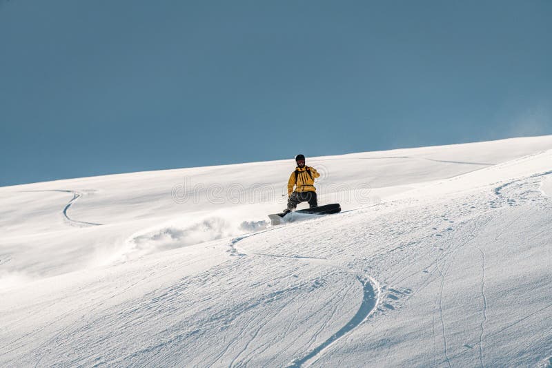 One-armed Splitboarder Maneuvers His Splitboard Down a Snowy ...