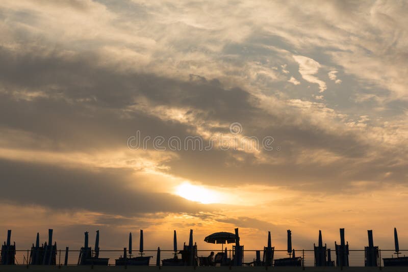 Only One Beach Umbrella Open at Sunset, Summer Ending Stock Photo ...