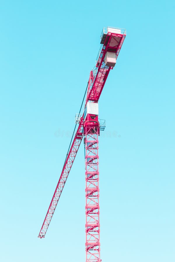 One Big Coral Pink Colour Construction Cranes on Blue Sky Background ...