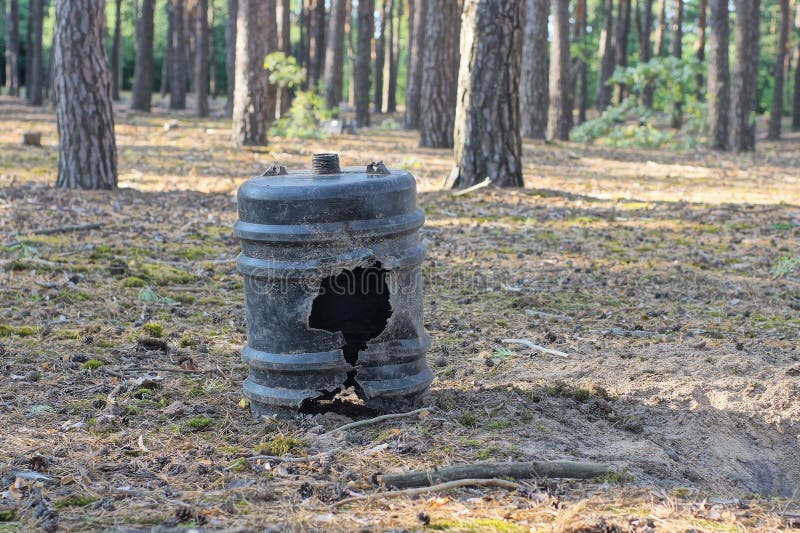 One Big Old Broken Black Plastic Barrel with a Hole Stands on the ...