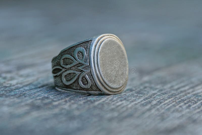 Large Old Silver Ring with a Pattern on a Gray Table Stock Image ...