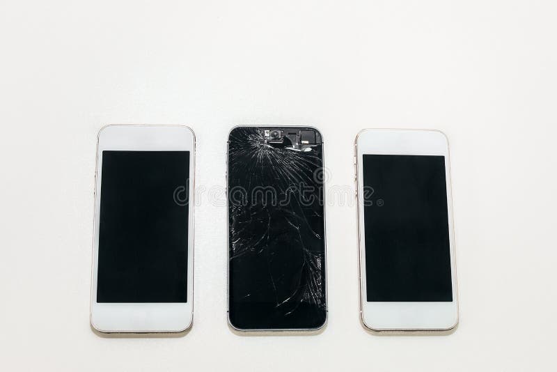 One Black Broken Phone and Two White Whole Next Stock Image - Image of ...