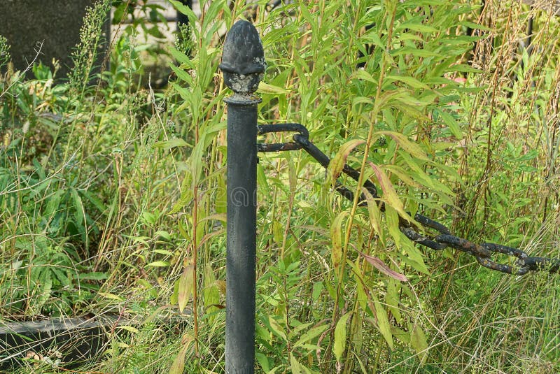 One Black Iron Pole with a Long Metal Chain Stock Photo - Image of form ...