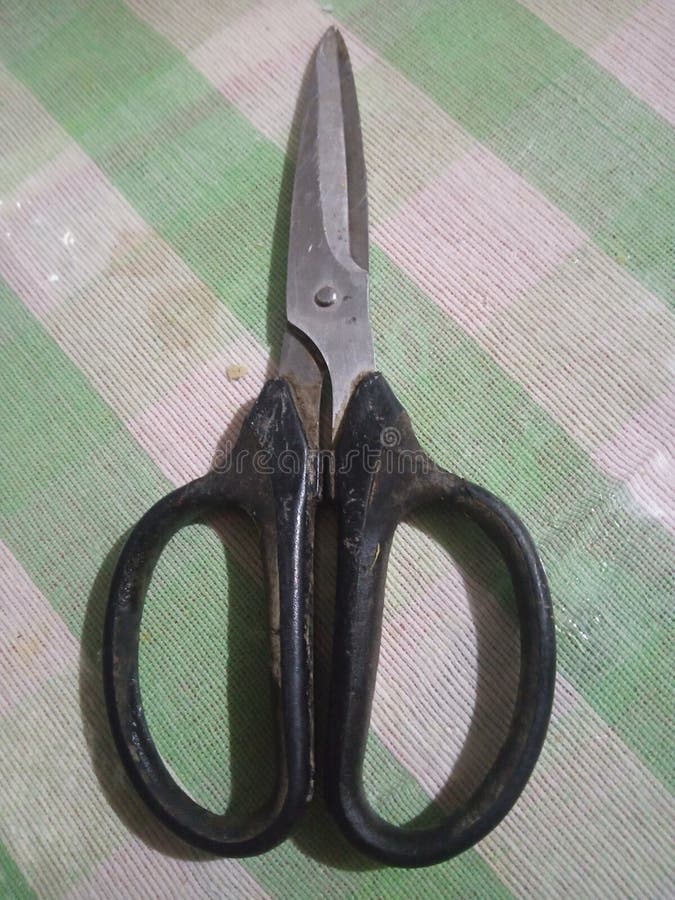 Scissors on the table stock image. Image of black, wood - 292614297