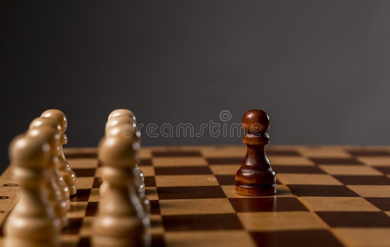 One Black Pawn Against Many Others. Different Against Monopoly Stock ...