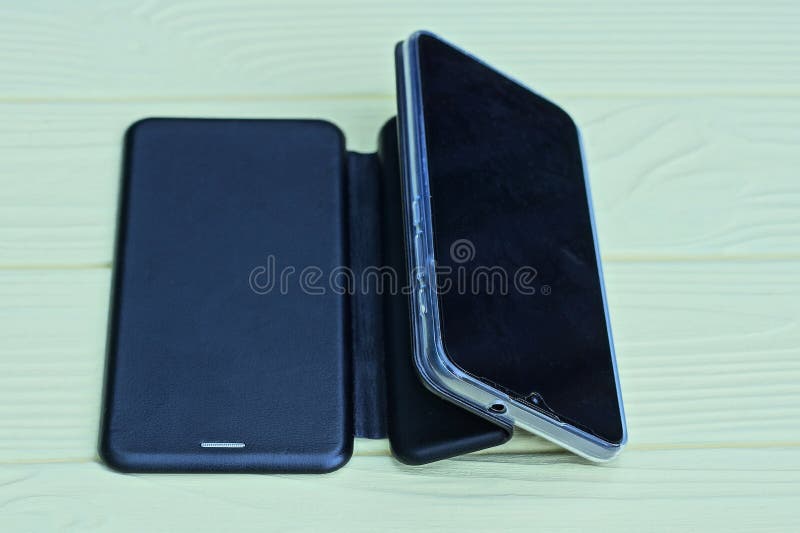 One Black Rectangular Telephone Smartphone in an Open Leather Case ...