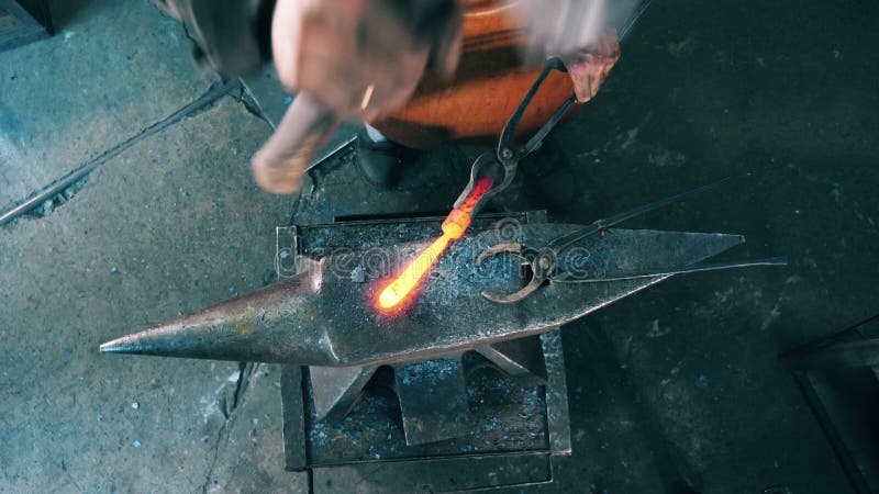 One Blacksmith Shapes Knife on Anvil, Using Hammer. Stock Footage ...