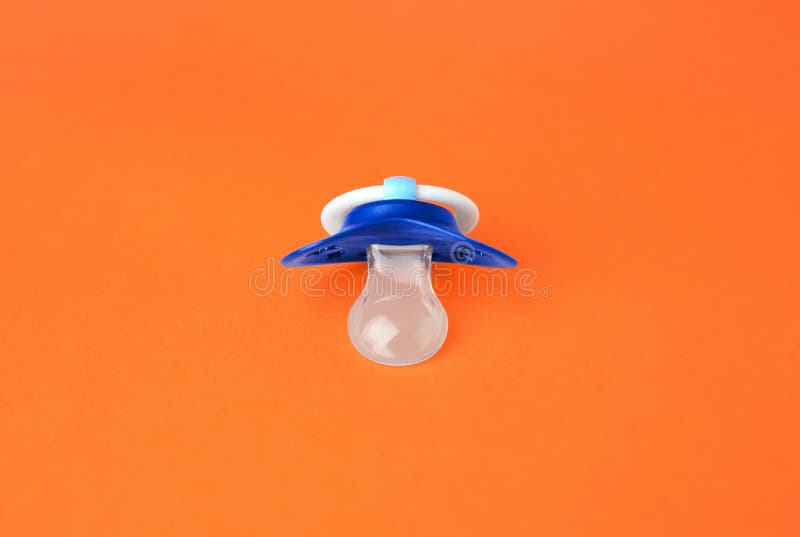 One Blue Baby Pacifier on Orange Background Stock Photo - Image of ...