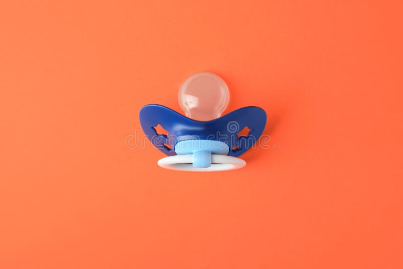 One Blue Baby Pacifier on Orange Background, Top View Stock Image ...