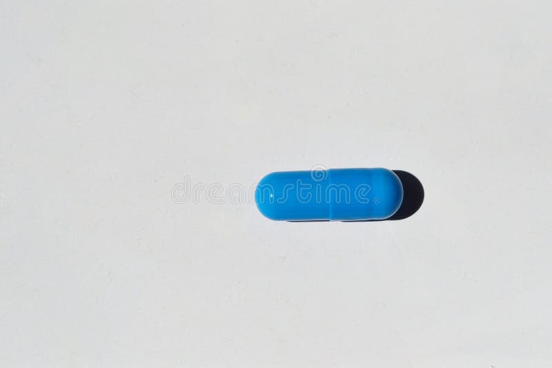 One Blue Pill Lying on a White Background Stock Image - Image of violet ...