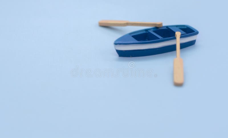 One Blue Toy Boat. Small Boat Models with Oars Stock Photo - Image of ...