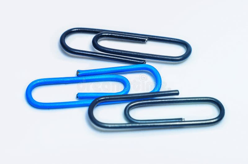 One Blue and Two Black Paper Clips for Everyday Office Use. White ...