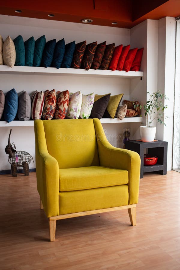 One-body Sofa in Front of a Wall with Cushions of Different Designs and ...