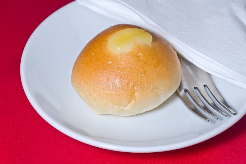 One bread on white plate stock photo. Image of bread - 27263414