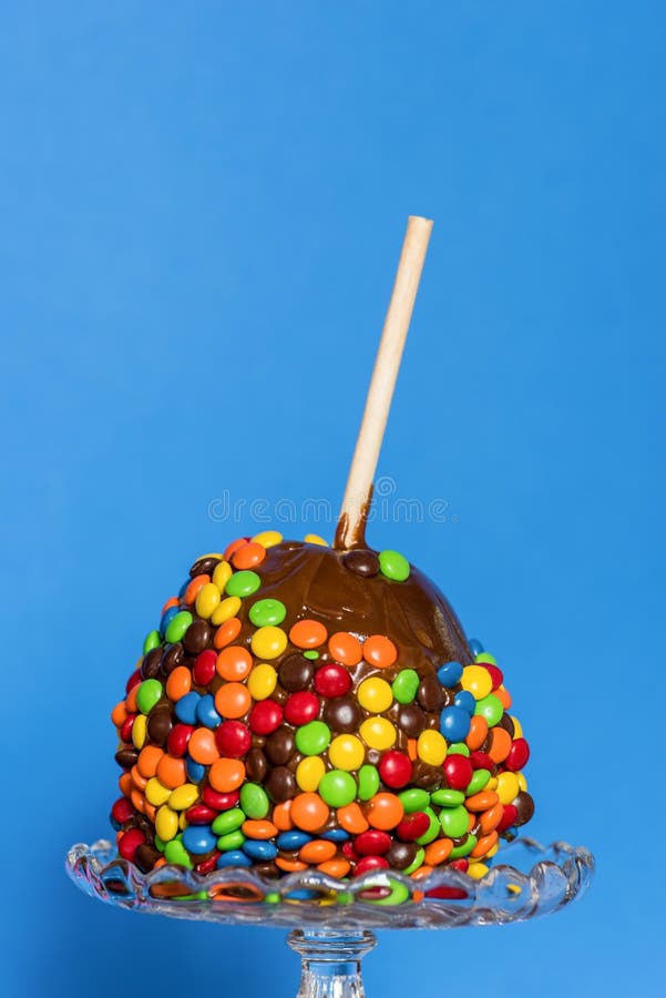 Closeup of Candy Apple on Blue Background Stock Photo - Image of ...