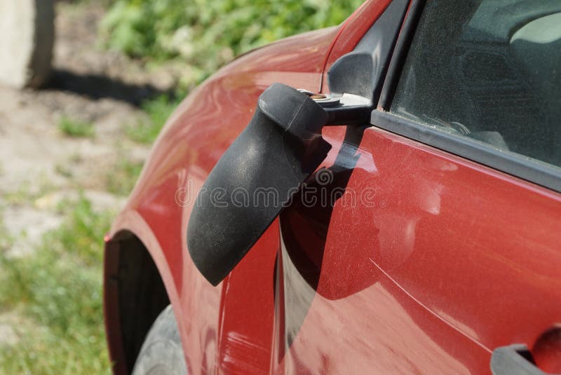One Broken Black Plastic on a Red Passenger Car Stock Photo - Image of ...
