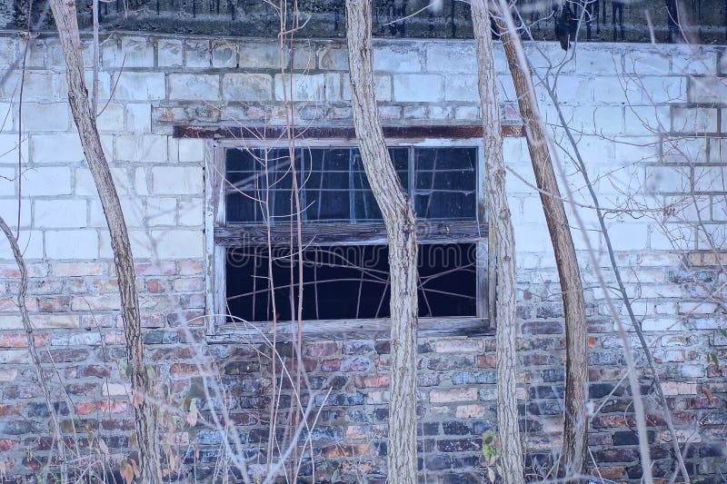 One Broken Window with Bars on a White Gray Brick Wall of a Building ...
