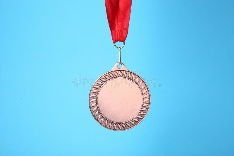 One Bronze Medal with Ribbon on Light Blue Background Stock Photo ...