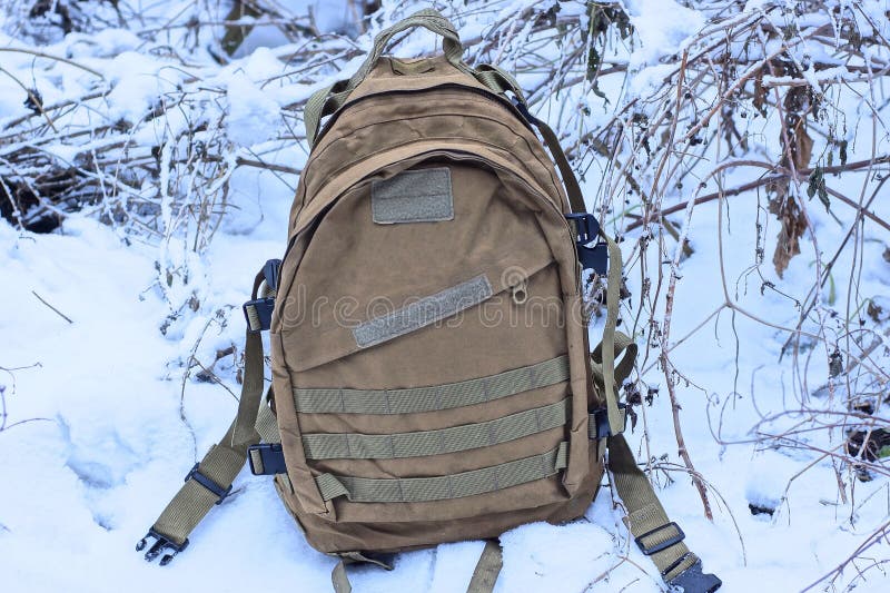 One Brown Army Backpack Stands on White Snow Stock Photo - Image of ...