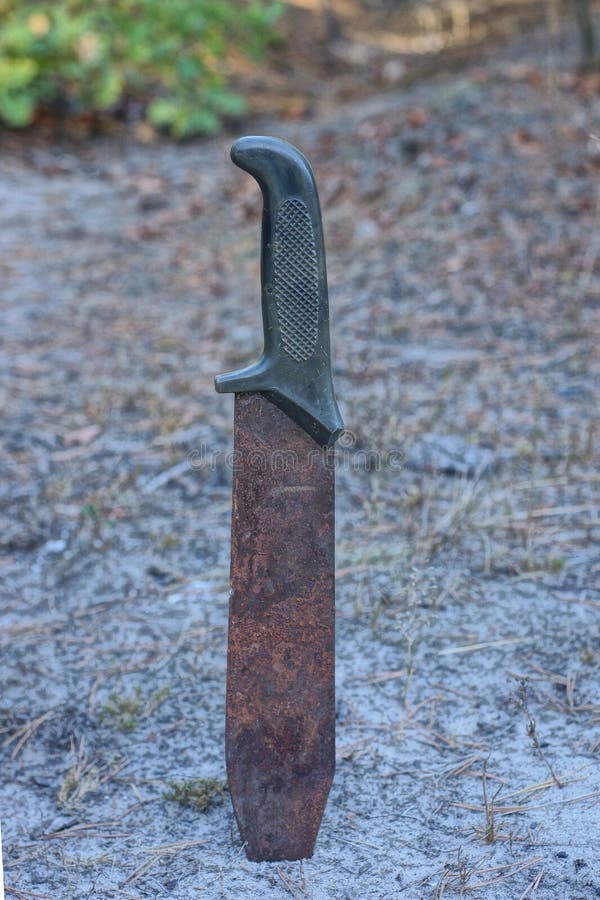 One Brown Rusty Big Old Machete Knife in Gray Ground Stock Photo ...