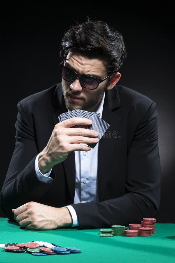 Caucasian Brunet Pocker Player at Pocker Table with Chips and Cards ...
