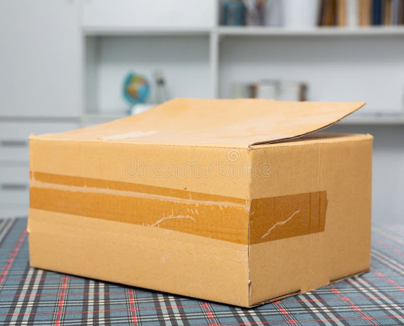One Cardboard Box on Top of Table Stock Image - Image of delivering ...