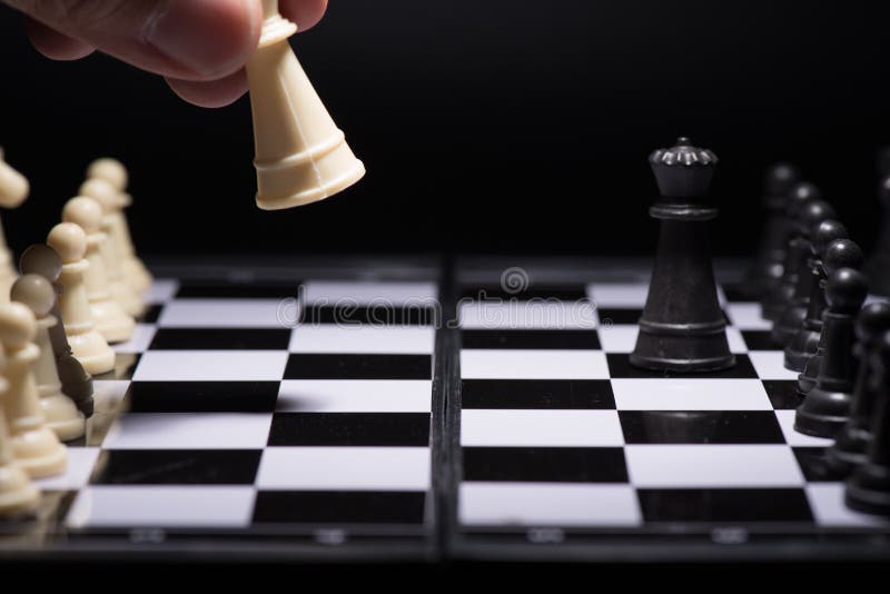 One Chess Pieces Staying Against Black Chess Pieces Stock Photo - Image ...
