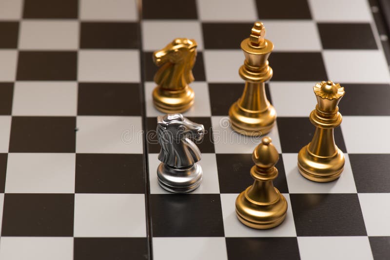 One Chess Pieces Staying Against Full Set of Chess Pieces Stock Photo ...