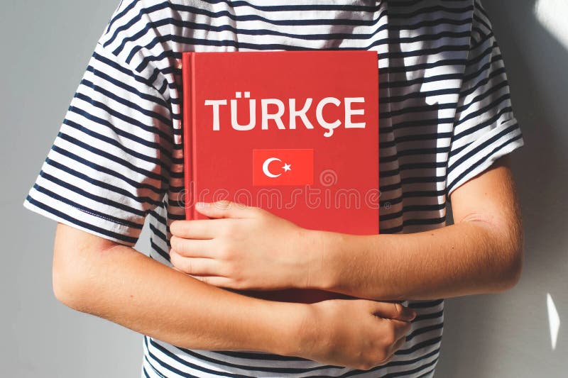 One Child Girl, Whose Face is Not Visible Holds a Red Turkish Language ...
