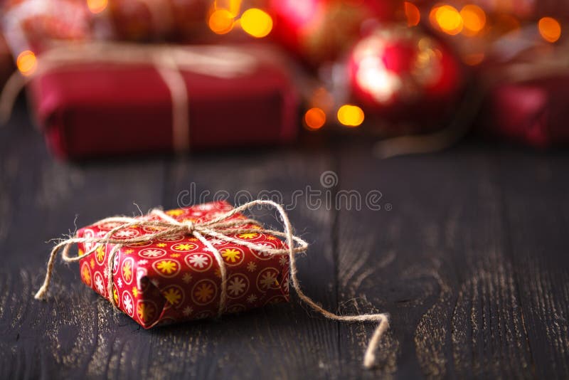 One Christmas Gift Box in Front of a Bunch of Presents on the Ta Stock ...
