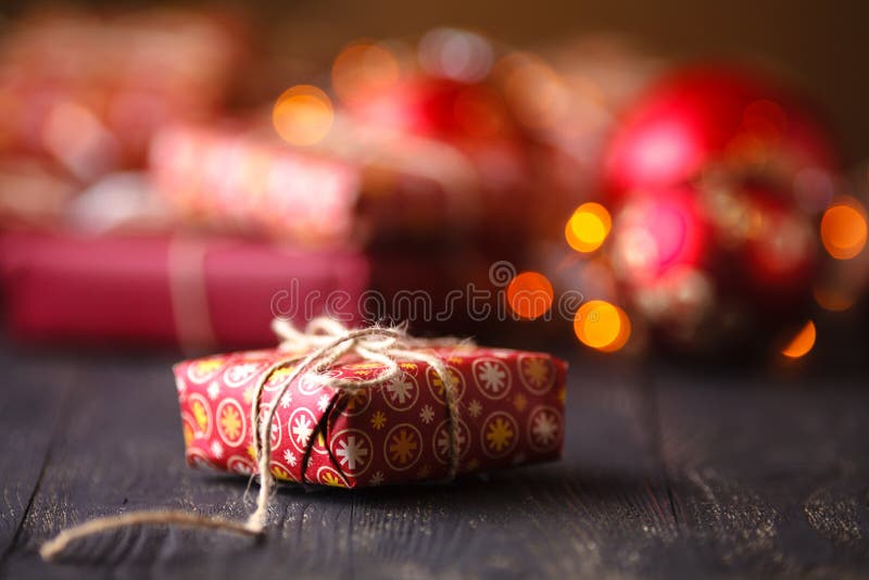 One Christmas Gift Box in Front of a Bunch of Presents on the Ta Stock ...