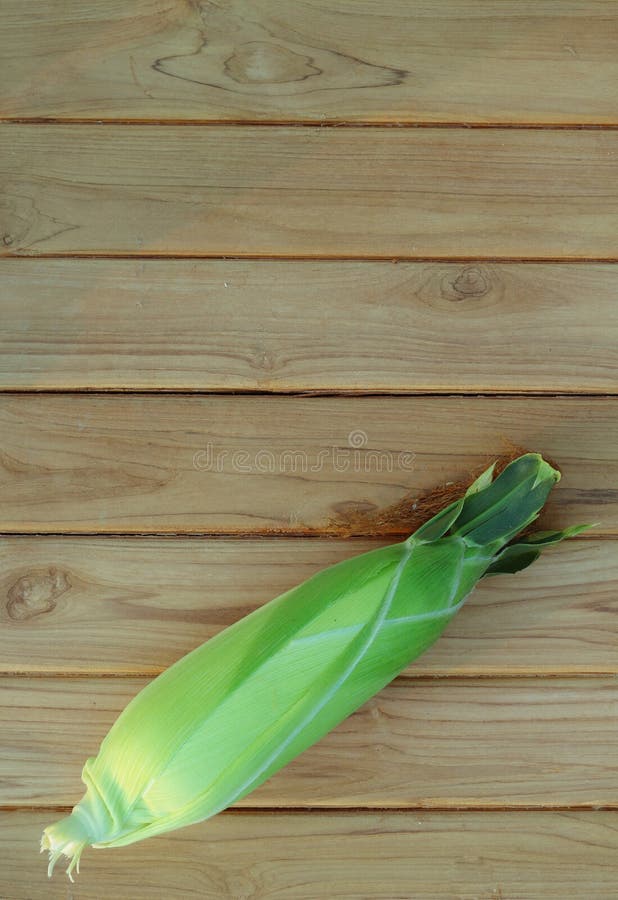 One corn on wood table stock image. Image of fresh, focus - 72541387