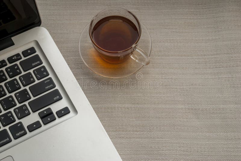 One Cup of Tea is on the Right Side of the Laptop Stock Image - Image ...