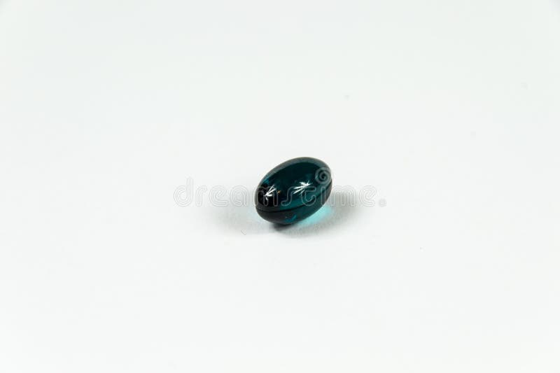 One Dark Green Soft Gelatine Capsule. Stock Photo - Image of soft ...