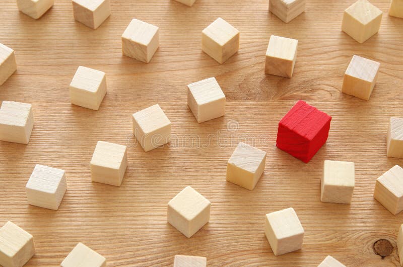 One Different Red Cube Block among Wooden Blocks. Individuality ...