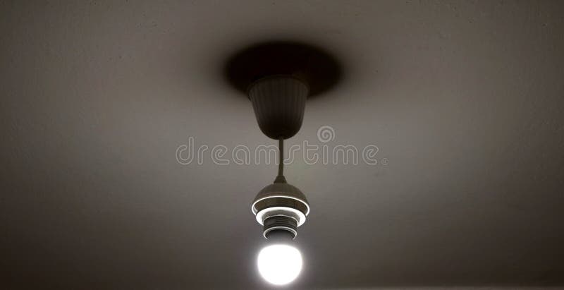 A Dim Lamp on the Ceiling in a Dark Room Stock Image - Image of ...