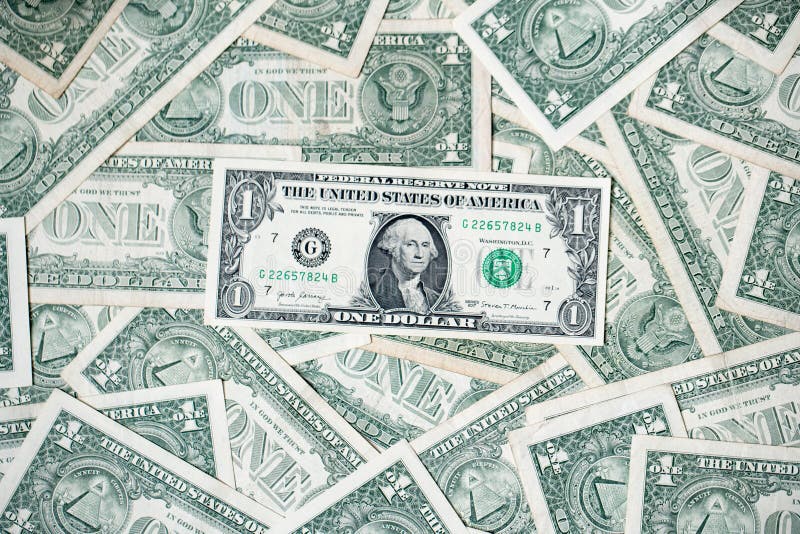 One Dollar Banknote on Top of Spread Out Dollar Bills on the Back Side ...