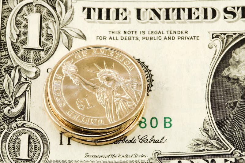 One dollar coin on note stock photo. Image of currency - 1999926