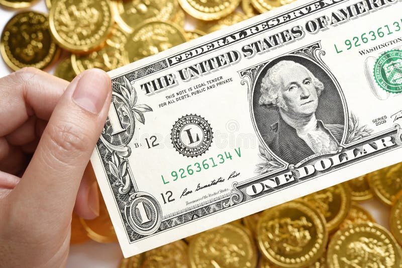 One dollar on hand editorial image. Image of business - 77525020