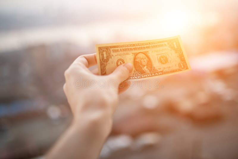 One dollar in hand. stock photo. Image of city, dollar - 105444774