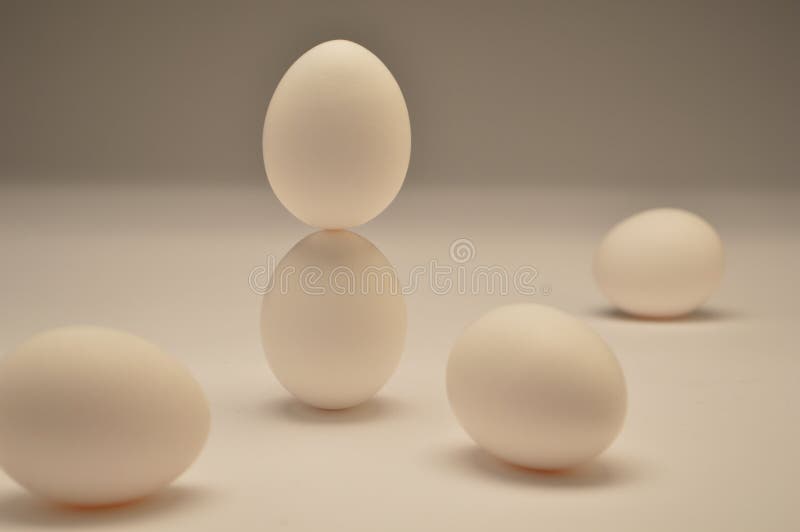 One Egg Balancing on Another Stock Photo - Image of unique, remarkable ...