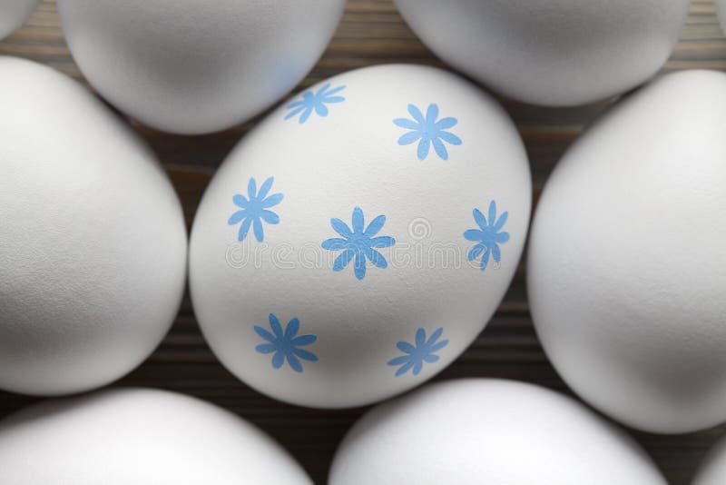 One Egg with Blue Pattern and White Eggs Stock Image - Image of ...
