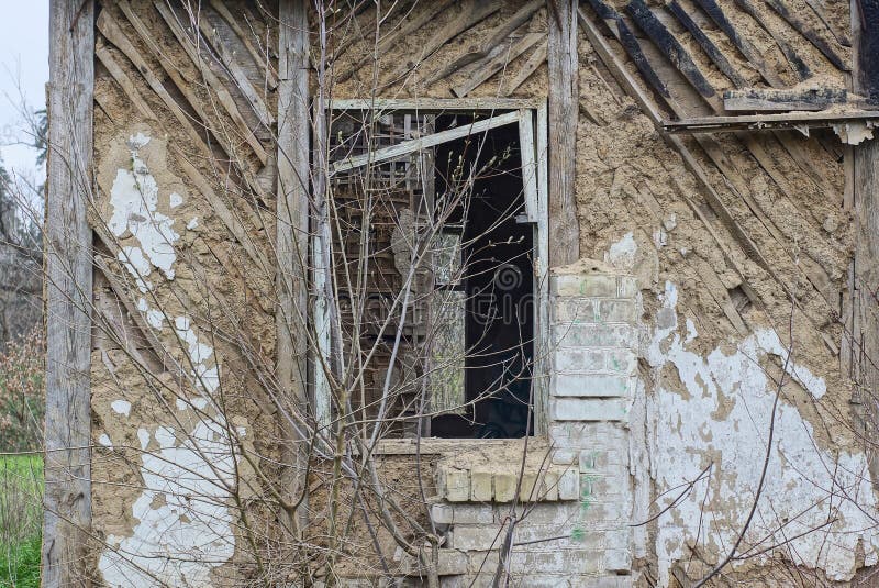 One Empty Old Broken Window with a Wooden Frame on a Brown Shabby Wall ...