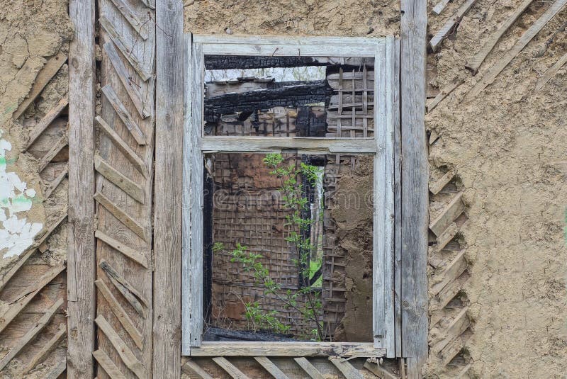 One Empty Old Broken Window with a Wooden Frame on a Brown Shabby Wall ...