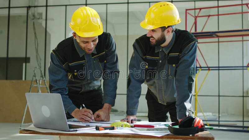One Engineer and Constructor Man at Construction Site Analysing the ...