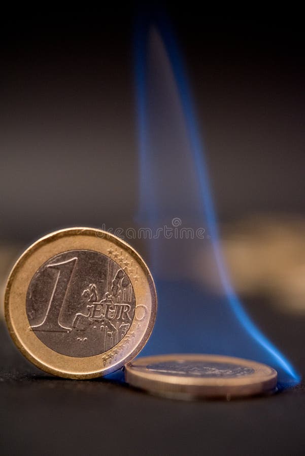 One euro coins on fire stock photo. Image of business - 86238742