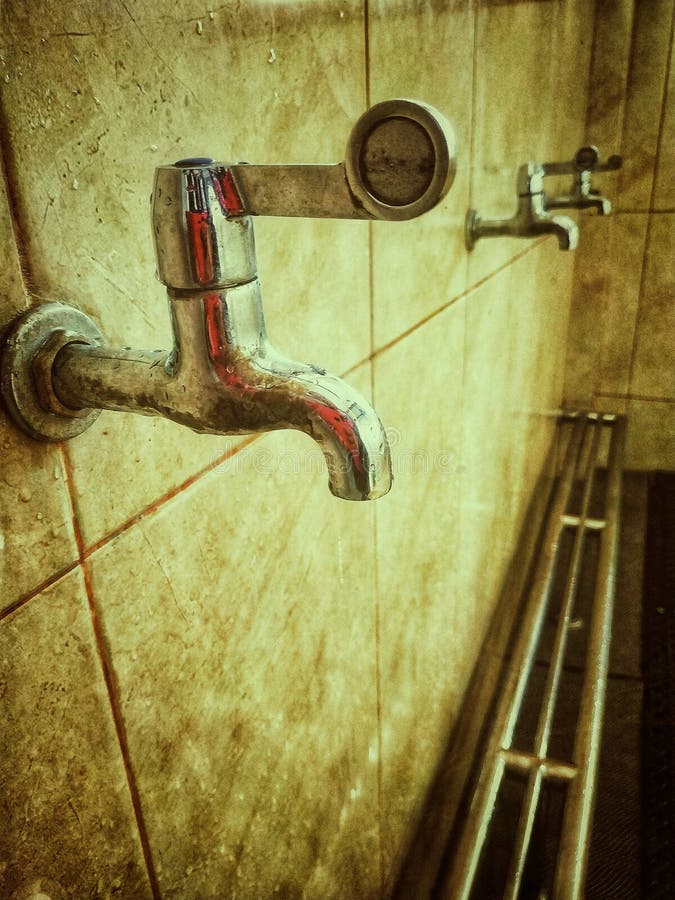 Rows of Water Taps for Ablution. Stock Image - Image of water, rows ...